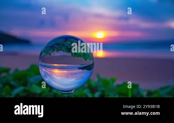 Time lapse A captivating sunset reflected through a crystal ball ...