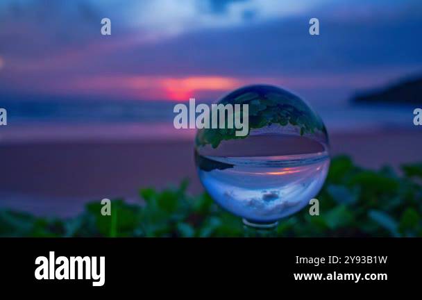 Time lapse A captivating sunset reflected through a crystal ball ...