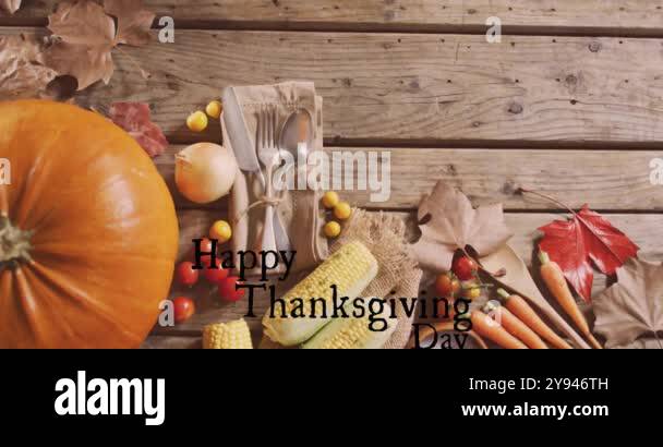 Animation of happy thanksgiving day text over autumn leaves and produce ...