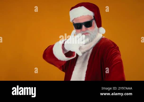 Chest up stab shot of cool rocker in Santa Claus traditional costume ...