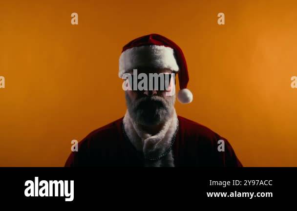 Chest up stab portrait of classy rocker Santa Claus in sunglasses ...