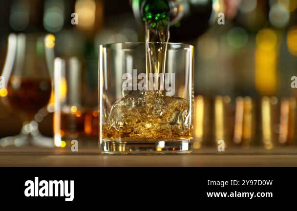 Super Slow Motion of Pouring Whiskey Into Glass. Filmed on High Speed ...