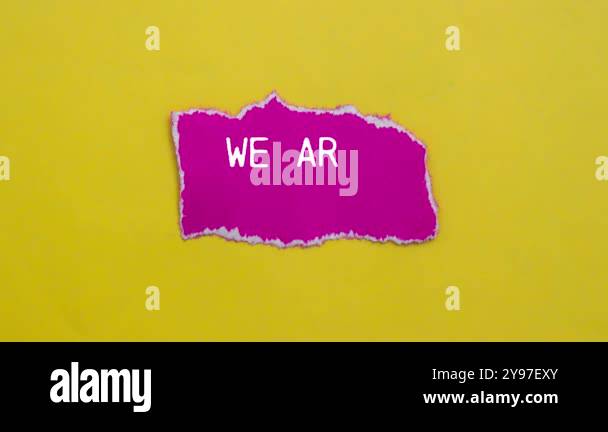 We are hiring message writing on ripped torn pink paper piece on yellow background. Conceptual ...