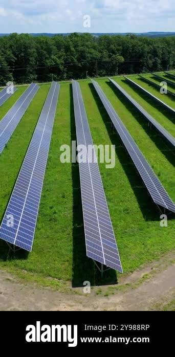 Motion camera view of the solar panels with blue sky background ...