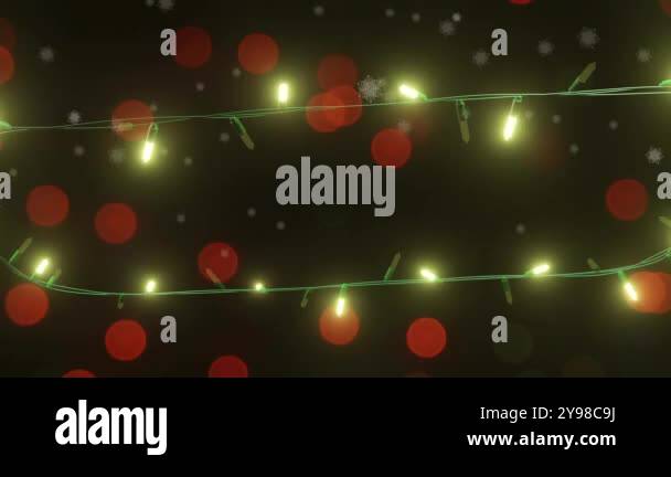 Flashing yellow christmas string lights and red bokeh light spots over ...