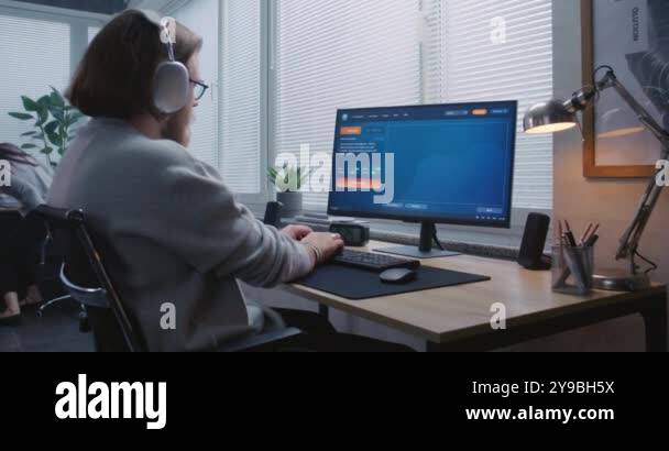 Adult man in headphones enters prompt in artificial intelligence ...