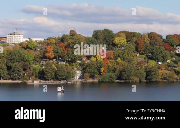 Stockholm, Sweden Fall colors in the trees over the Tantolunden Park in ...
