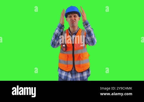 distressed construction worker dressed in an orange safety vest and ...