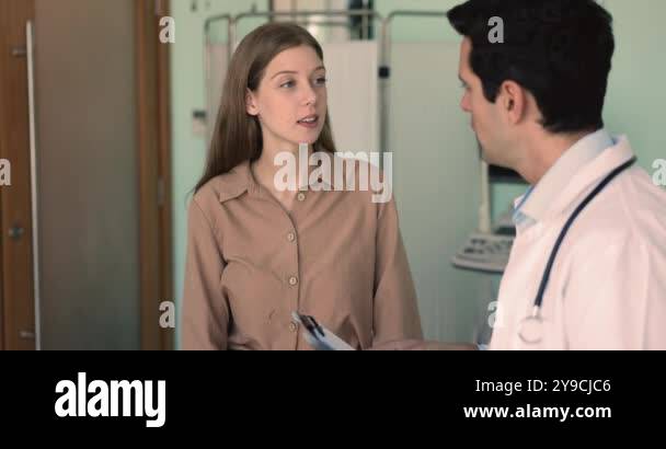 Doctor and patient discuss treatment options, current symptoms ...