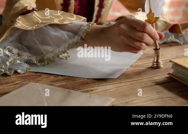 Medieval female writes with old feather pen. Antique young woman in ...