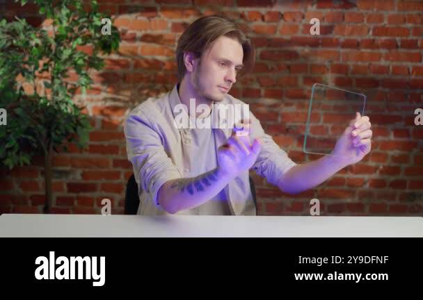 Person holding transparent gadget. Man holding innovative futuristic ...