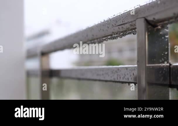 Balcony railings in the rain, selective focus. Close-up of balcony ...