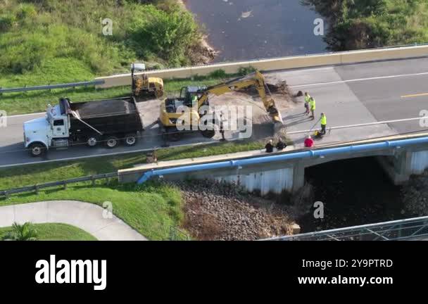 Repair of destroyed bridge after hurricane flood in Florida ...