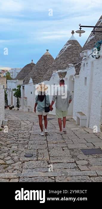 A romantic stroll through the iconic trulli houses of Alberobello ...