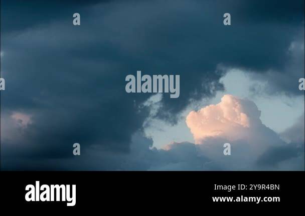 A time-lapse capturing the dynamic movement of pink and blue clouds in ...