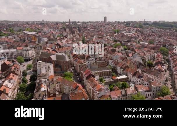 Panning over Brussels reveals a charming cityscape with traditional ...