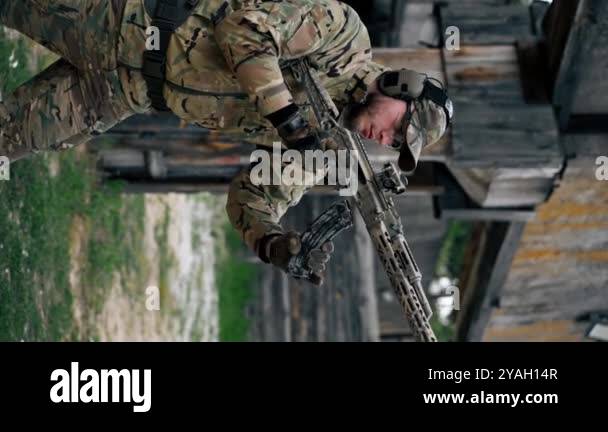 vertical video military tactical strategy aiming from NATO rifle ...