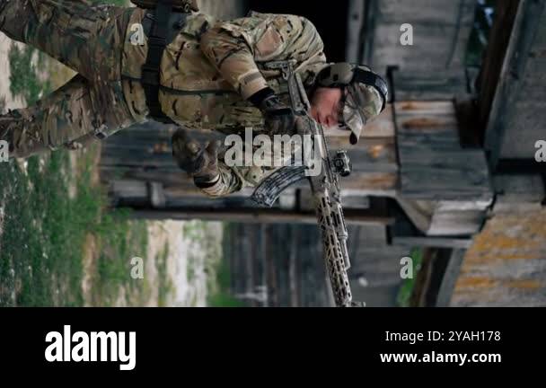 vertical video military tactical strategy aiming from NATO rifle ...