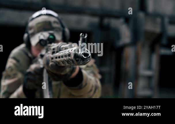 close-up military tactical strategy aiming at the camera NATO rifle ...
