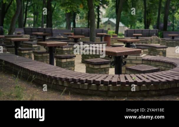 park area for visitors to relax small stone tables with wooden benches ...