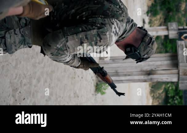 vertical video close up military tactical strategy rifle position for ...