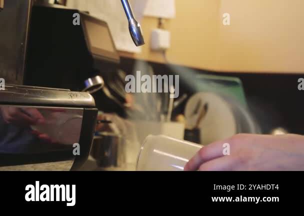 Washing the coffee machine. Large coffee machine. The barista washes ...