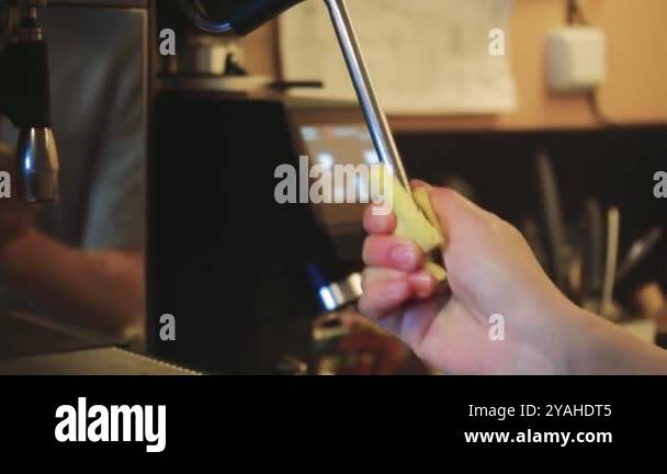Washing the coffee machine. Large coffee machine. The barista girl ...