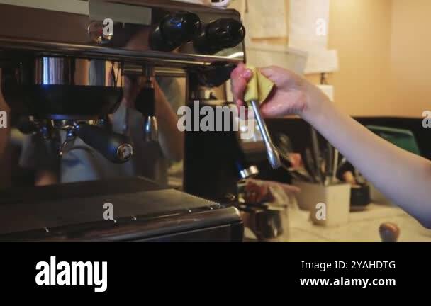 Washing the coffee machine. Large coffee machine. The barista washes ...