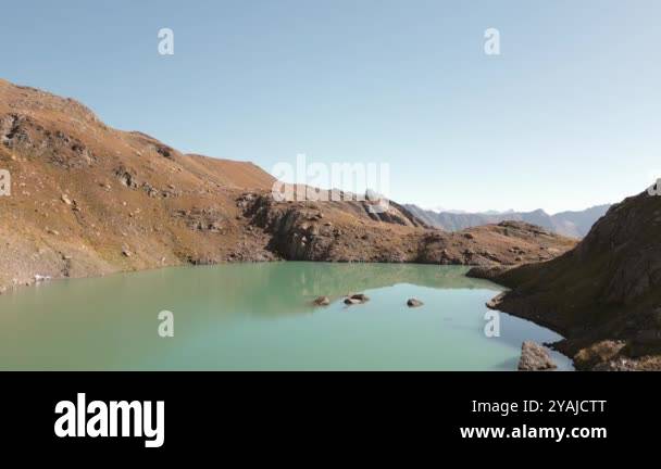 Aerial ascending rising view Tsakatskarish lake. Samegrelo-Zemo Svaneti ...