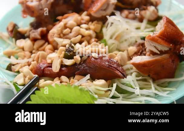 Close up roasted pigeon dish in plate on street food district in Hanoi ...