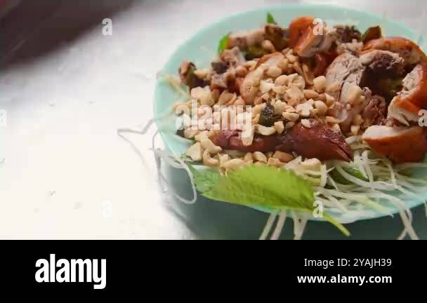 Close up roasted pigeon dish in plate on street food district in Hanoi ...