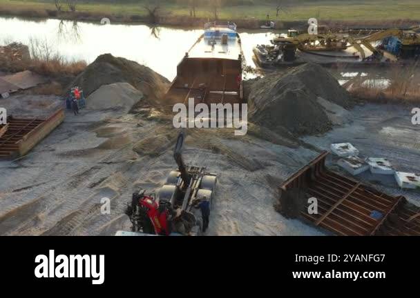 Above view, dolly move around over excavator and tow truck as they pull ...