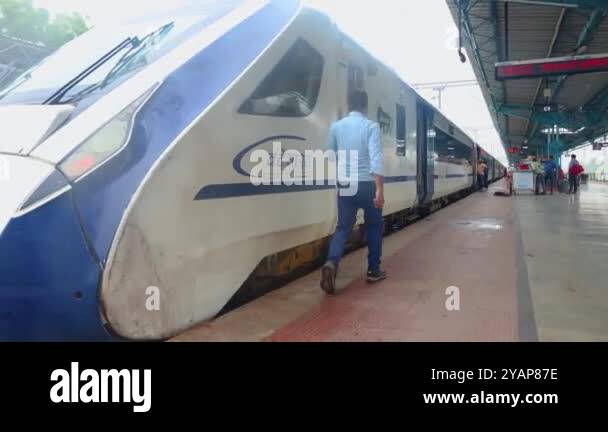 Loco pilot boarding on High Speed Passenger Train standing at platform ...