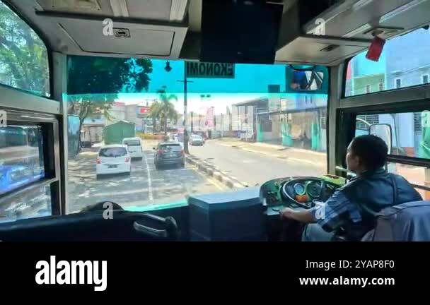 Traveling with a short hop intercity bus in Asia front seat view ...