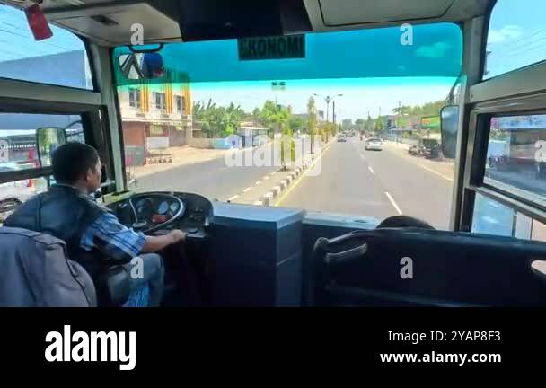 Traveling with a short hop intercity bus in Asia front seat view ...