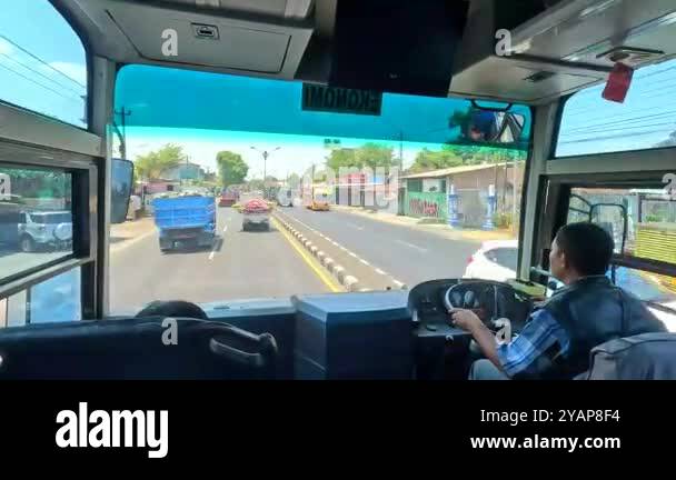 Traveling with a short hop intercity bus in Asia front seat view ...