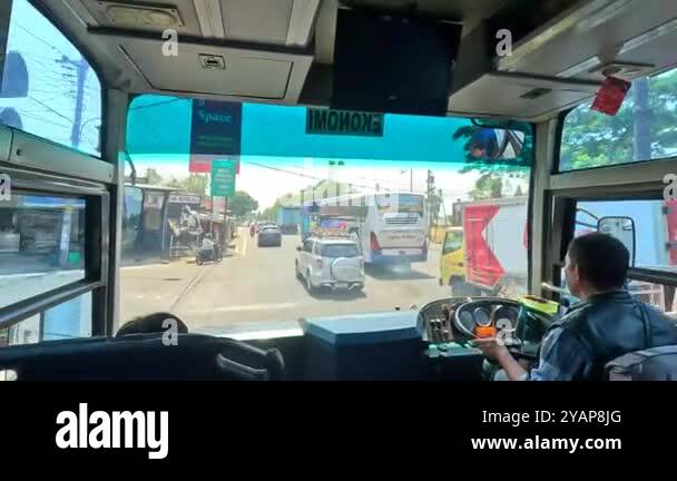 Traveling with a short hop intercity bus in Asia front seat view ...