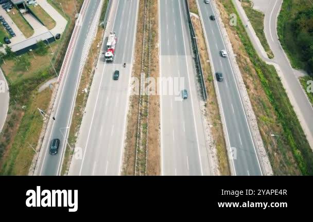 Urban veins: Drone footage over highway interlaced, reflecting non-stop ...