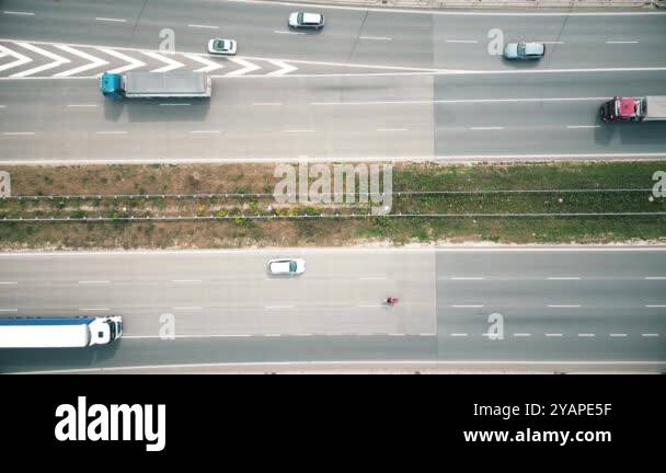 Urban veins: Drone footage over highway interlaced, reflecting non-stop ...