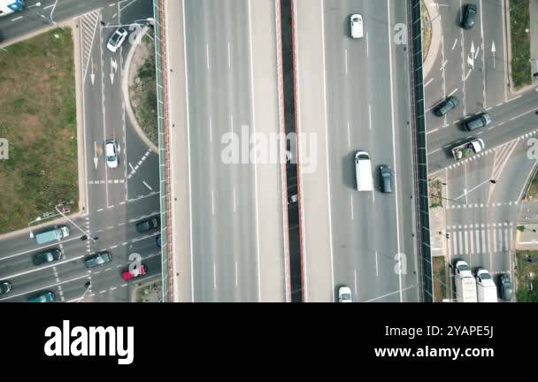 Urban veins: Drone footage over highway interlaced, reflecting non-stop ...