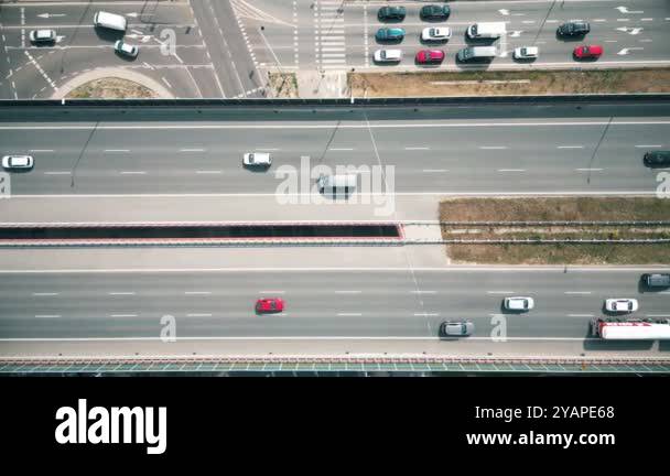 Urban veins: Drone footage over highway interlaced, reflecting non-stop ...