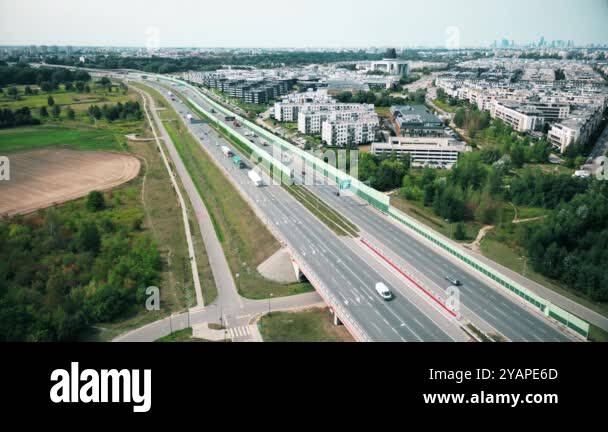 Urban veins: Drone footage over highway interlaced, reflecting non-stop ...