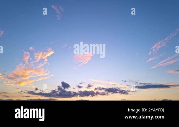 Sky time lapse. Moving clouds at sunset. Clouds float through the ...