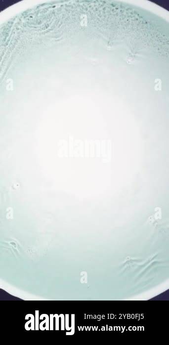 A mesmerizing display of a large pale blue orb exhibits intriguing ...