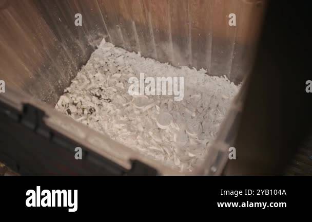 No people top shot of shredded white plastic polyethylene particles ...