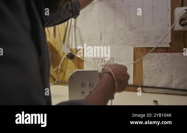 Closeup of hands and face of Indian male engineer measuring dimensions ...