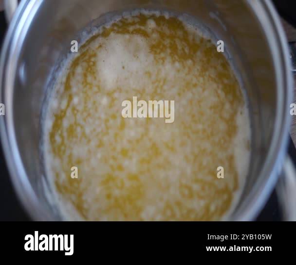 Ghee in traditional pot Stock Videos & Footage - HD and 4K Video Clips ...