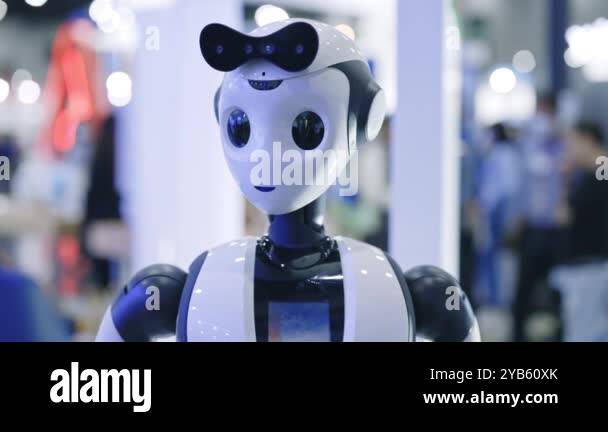 Portrait of robot looking standing on the blurred office background ...