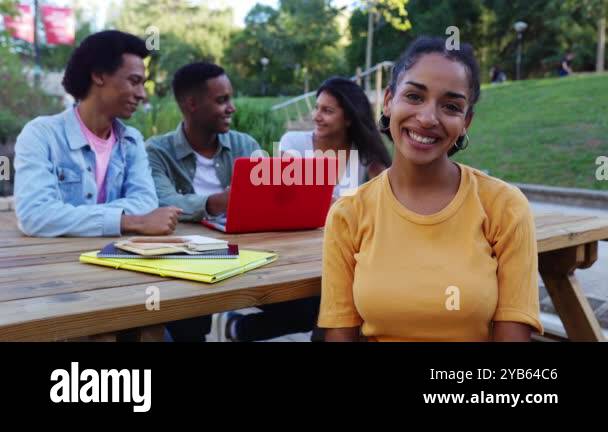 Portrait of young Latin American Gen Z student girl smiling at camera ...