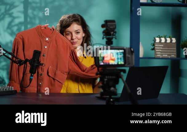 Influencer filming fashion content using professional camera, showing ...